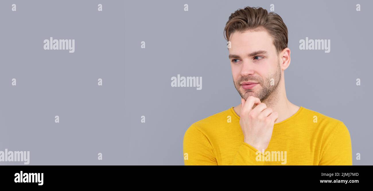 Handsome man with unshaven face portrait grey background, serious. Man ...