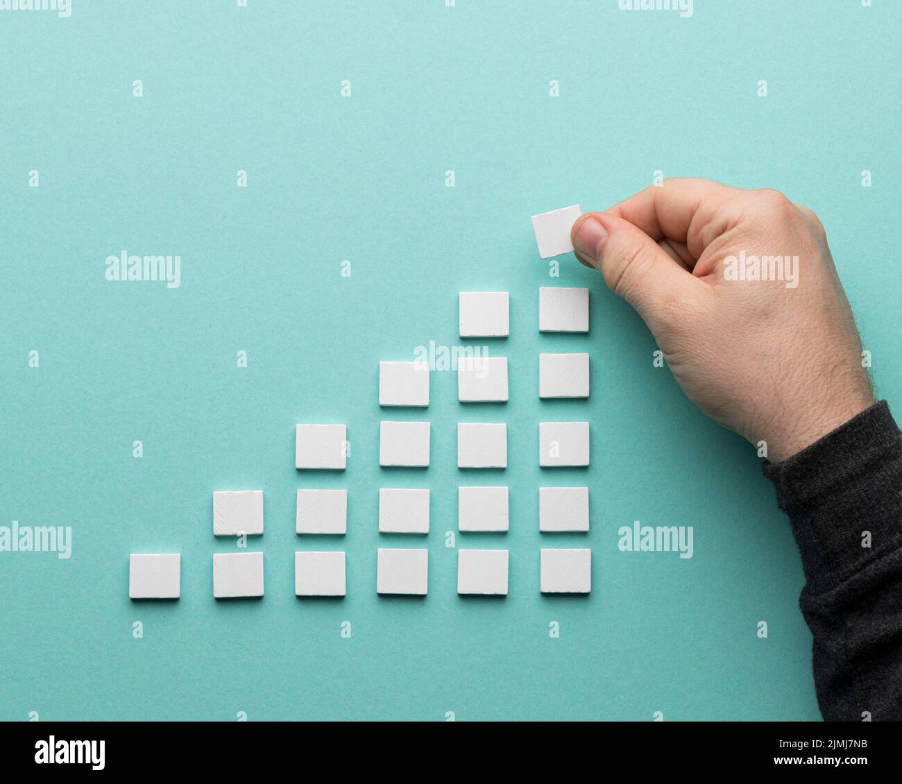 Graph made with white small cards Stock Photo - Alamy