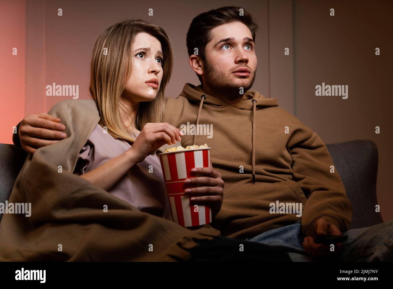 Woman watching tv popcorn hi-res stock photography and images - Alamy