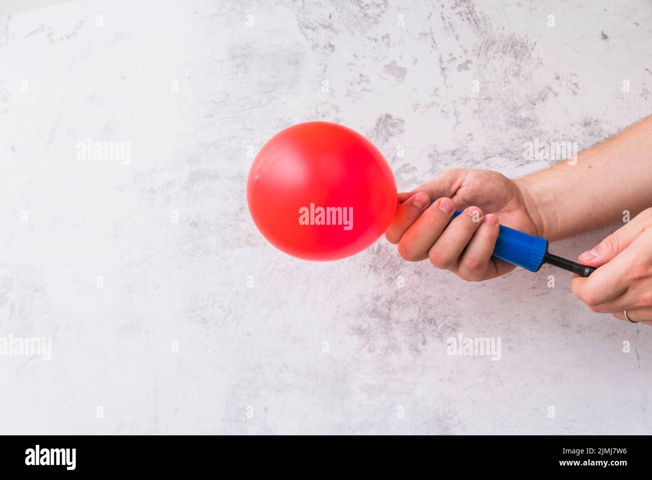 Blowing up balloon hi-res stock photography and images - Alamy