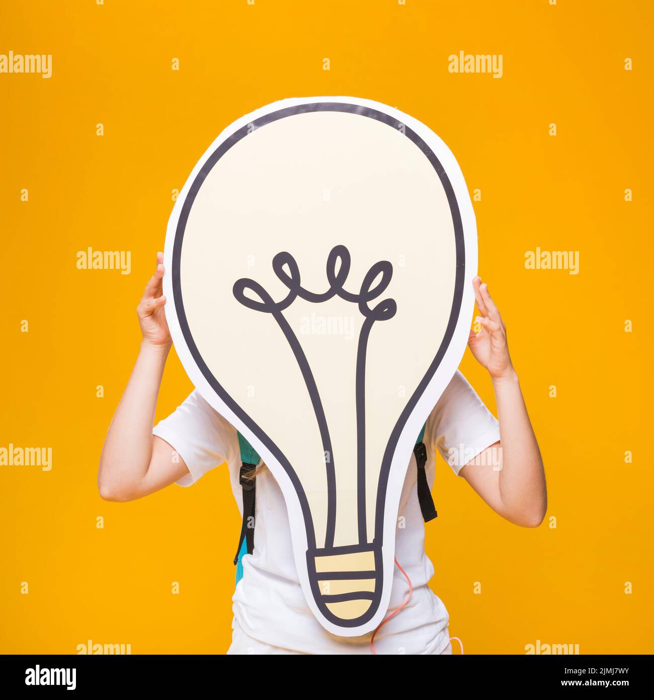 Portrait schoolgirl with big light bulb Stock Photo - Alamy