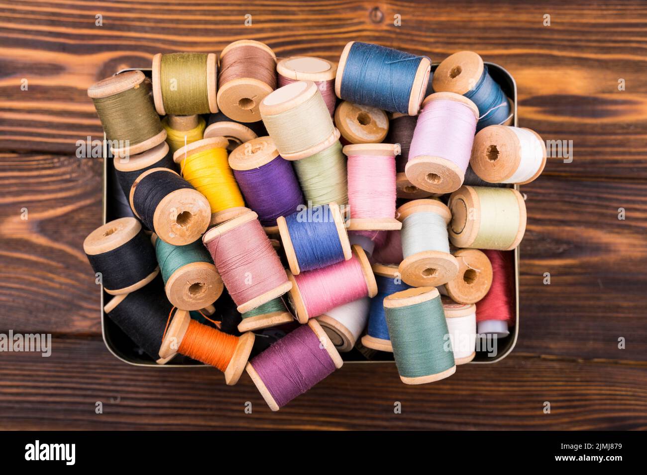 Box colorful thread spools Stock Photo - Alamy