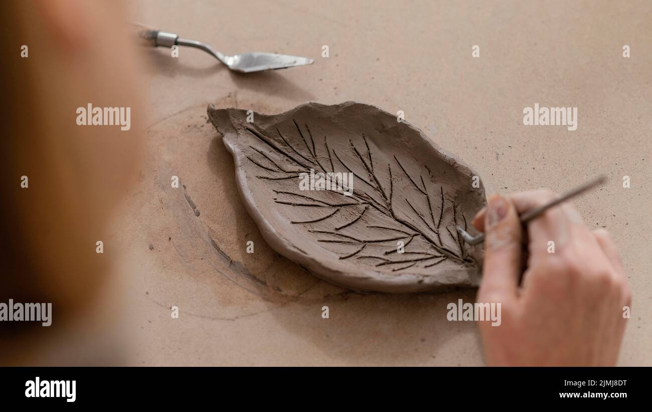 Hand with leaf hi-res stock photography and images - Alamy