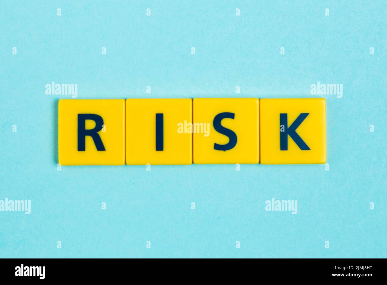 Risk word scrabble tiles Stock Photo - Alamy