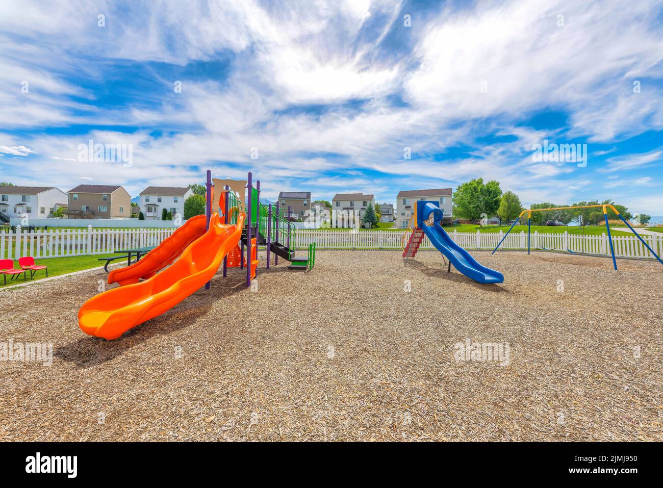 Empty small playground with slides and swings near the houses at Utah ...