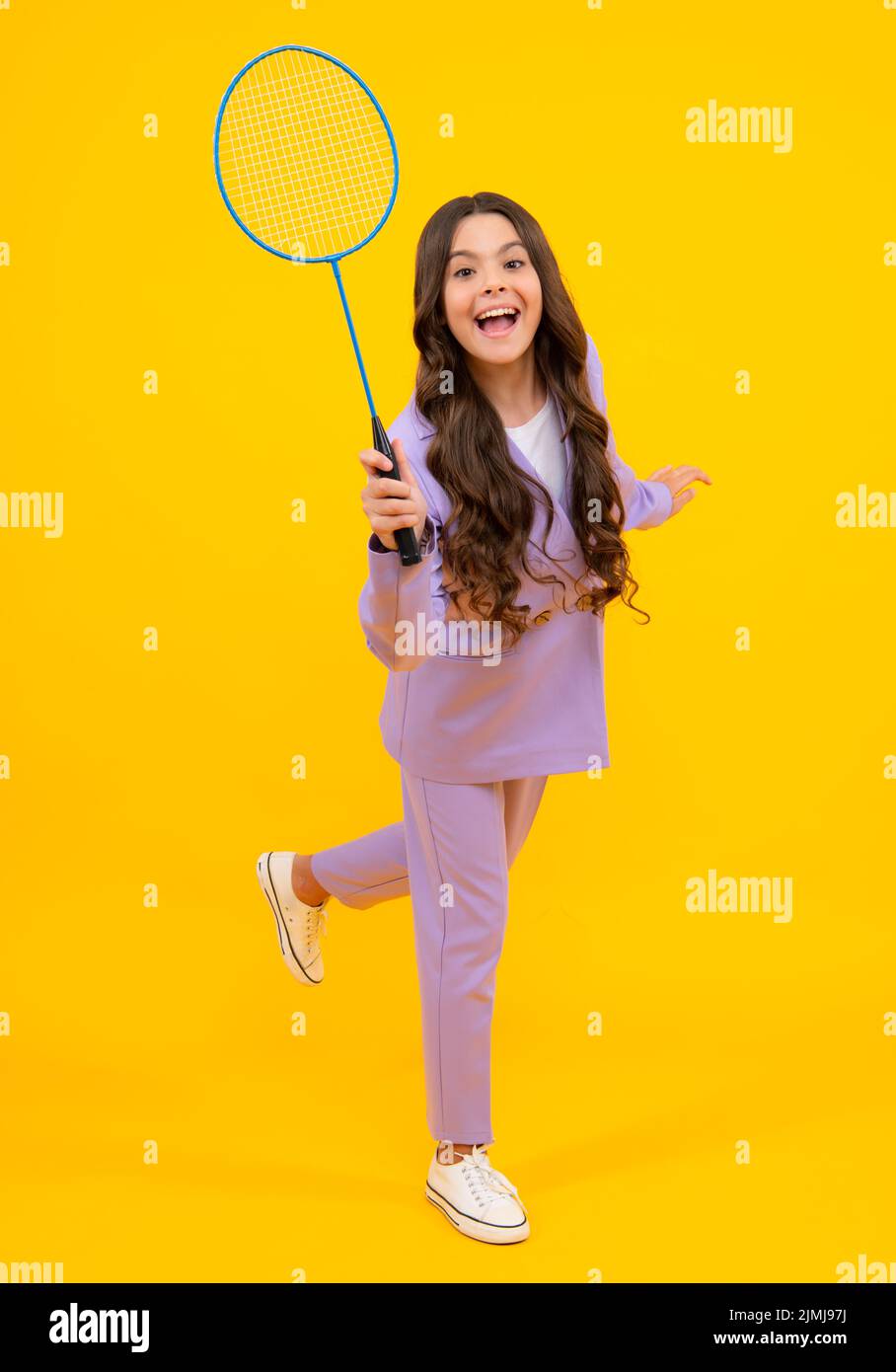 Teen girl badminton player in suit with badminton racket isolated on ...