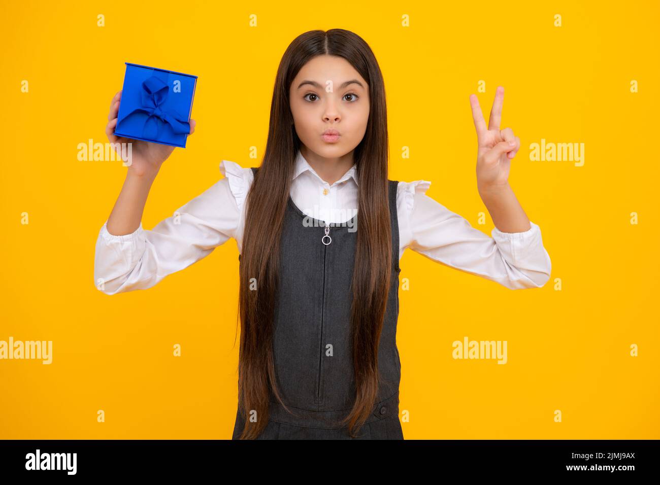 Teenager kid with present box. Teen child girl giving birthday gift ...