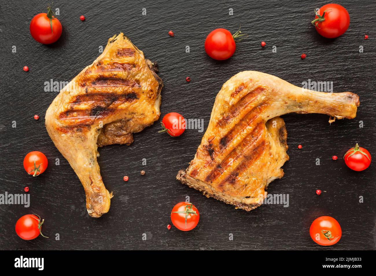 Top view baked chicken tomatoes Stock Photo - Alamy