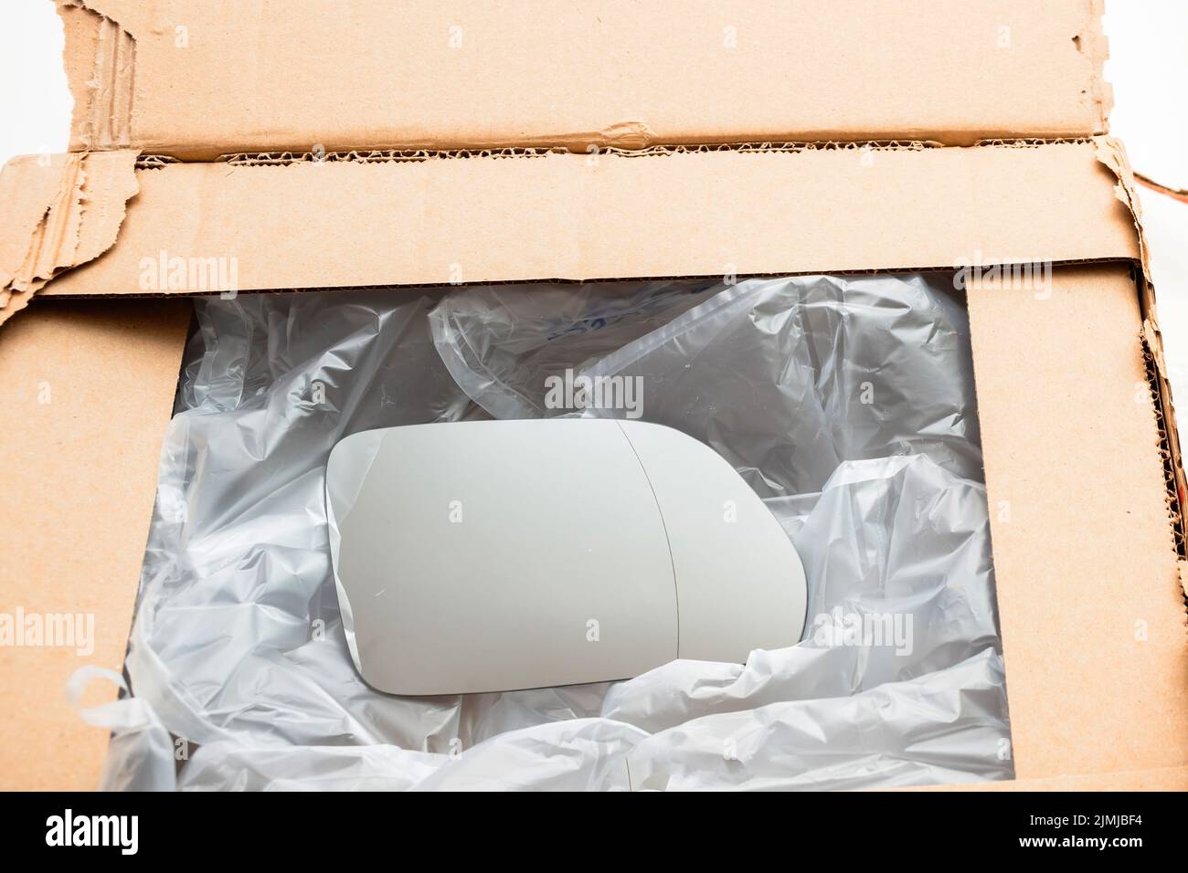 Opened packaging box with in packaging plastic air pouch wrapped around ...