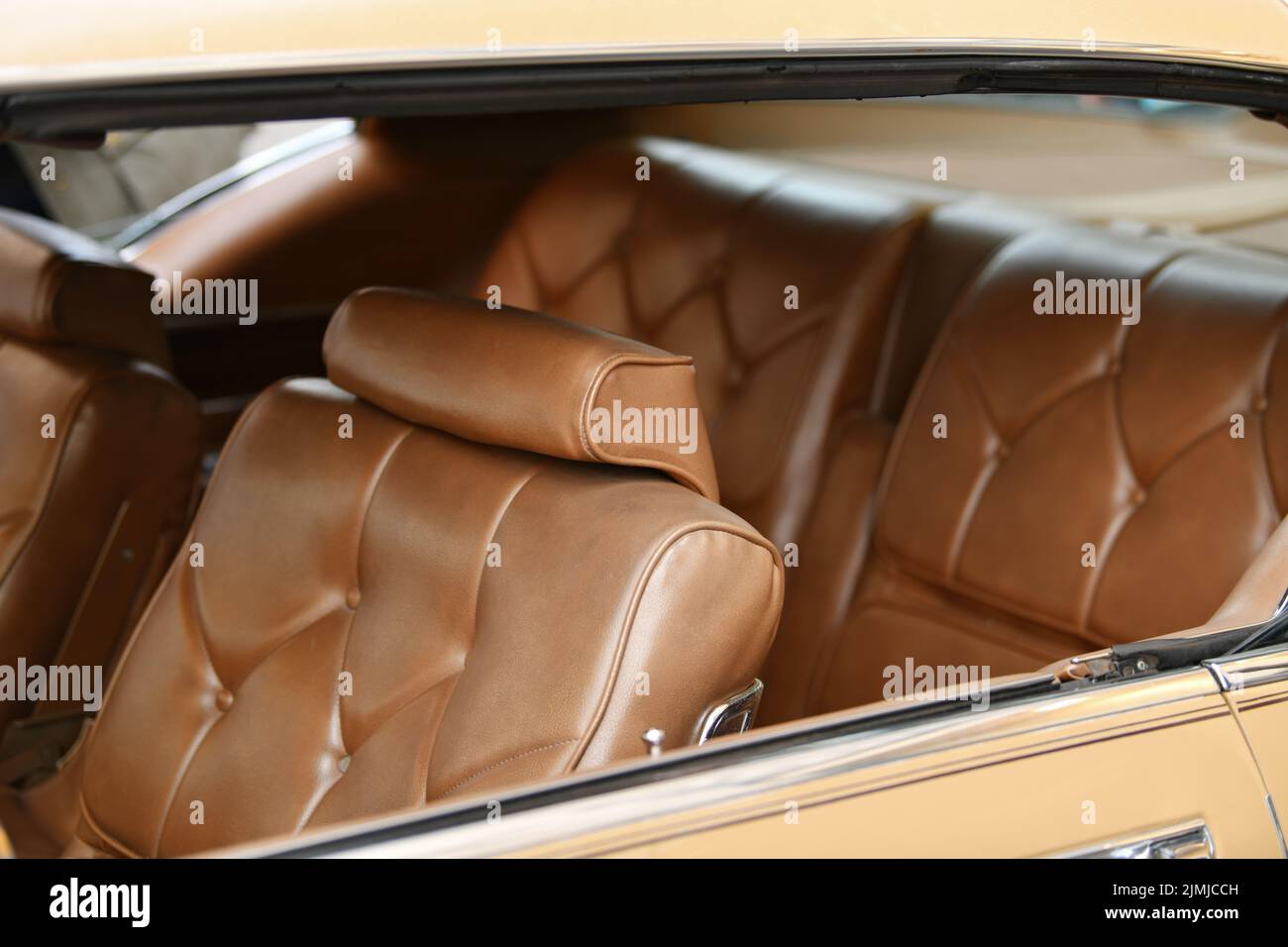A brown vintage armchair in a car interior Stock Photo - Alamy