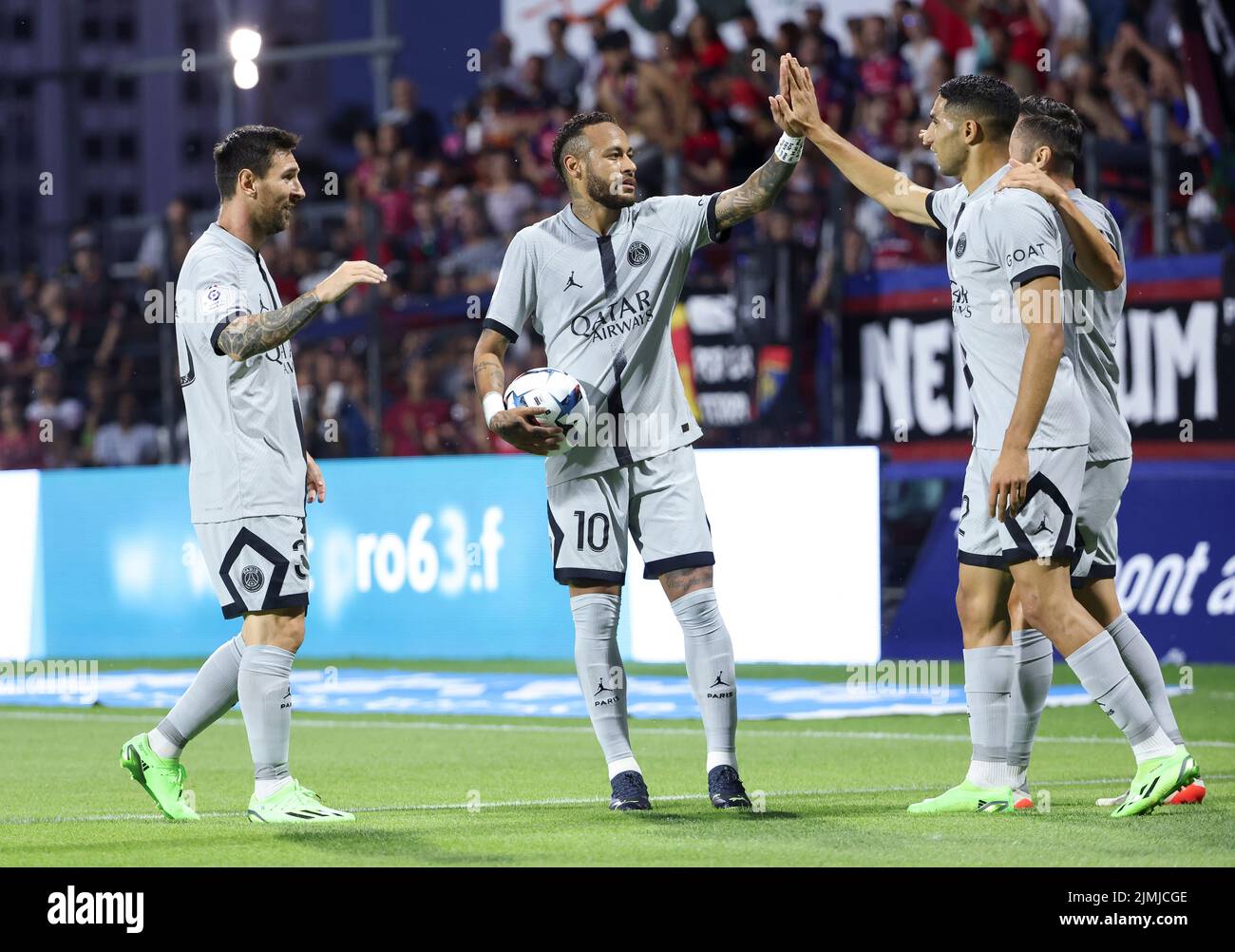 Achraf Hakimi of PSG (right) celebrates his goal with Lionel Messi ...