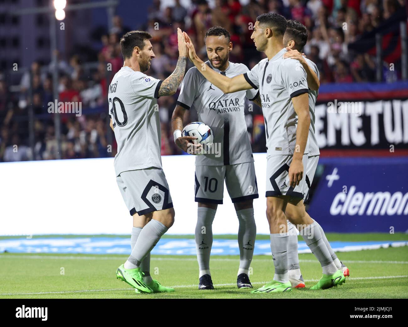 Achraf Hakimi of PSG (right) celebrates his goal with Lionel Messi ...