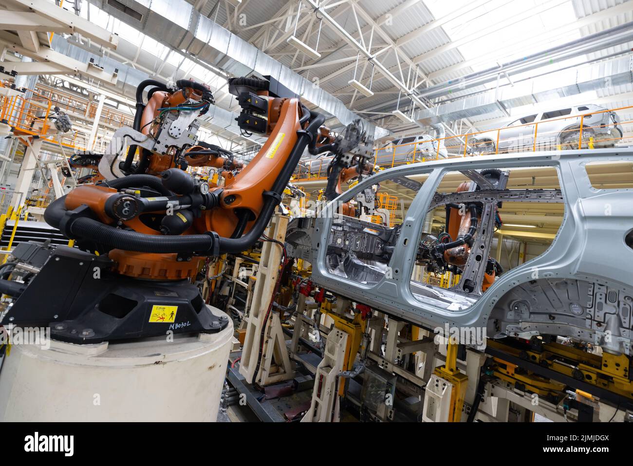 Photo of automobile production line. Welding car body. Modern car ...