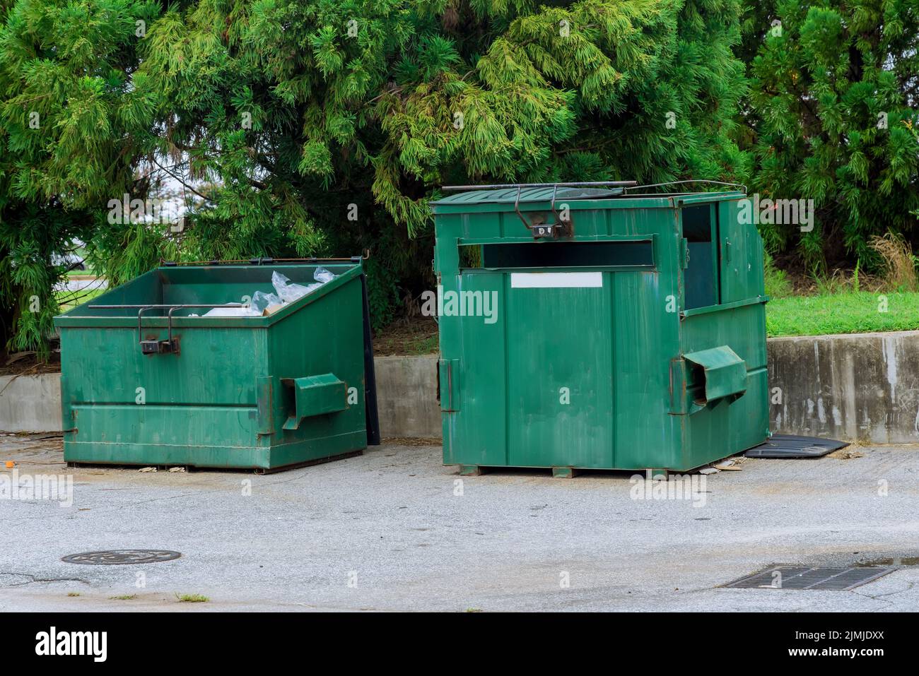 In the vicinity of an apartment building, there is a garbage container ...