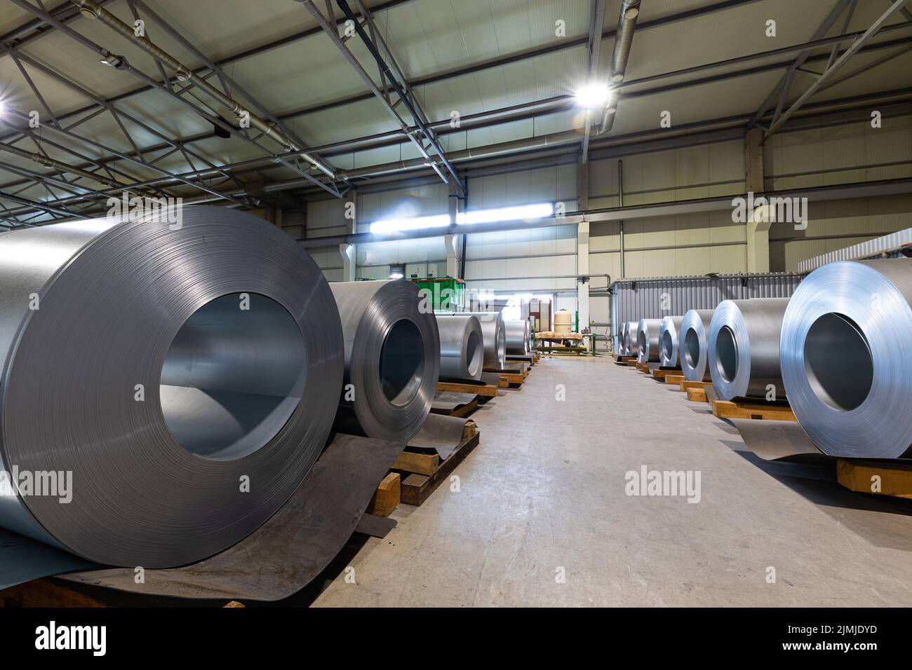 Closeup photo of metal tile for roof in metallic forming machine ...
