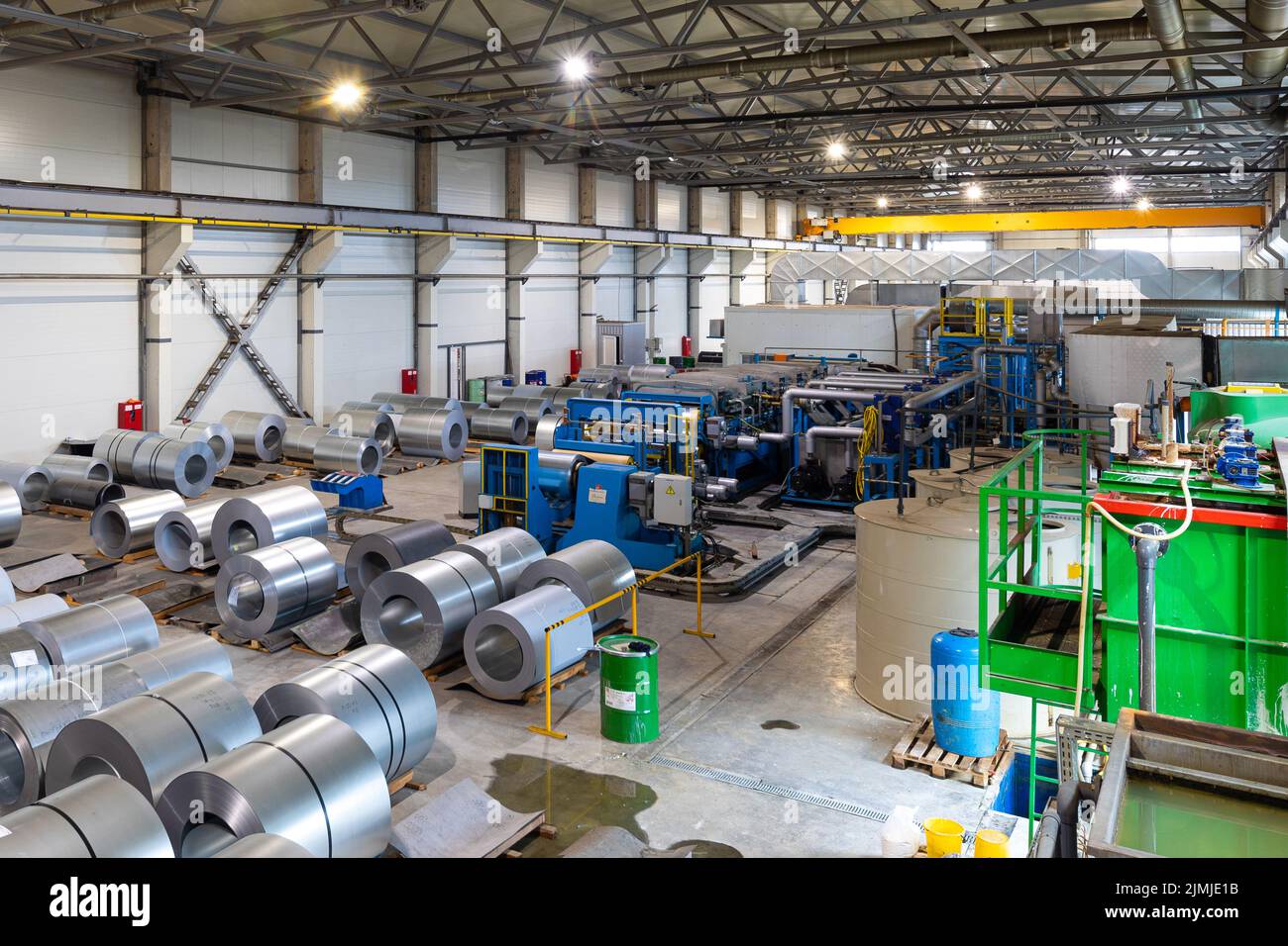 Photo of roll of painted galvanized steel sheet at cutting machine ...