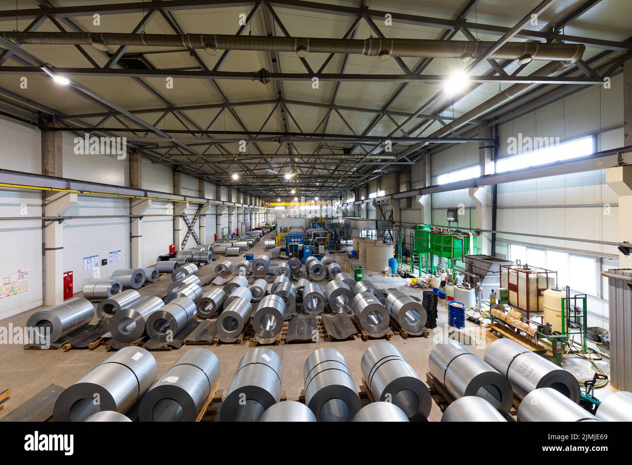 Photo of production line of metal tile for roof. Steel forming machine ...