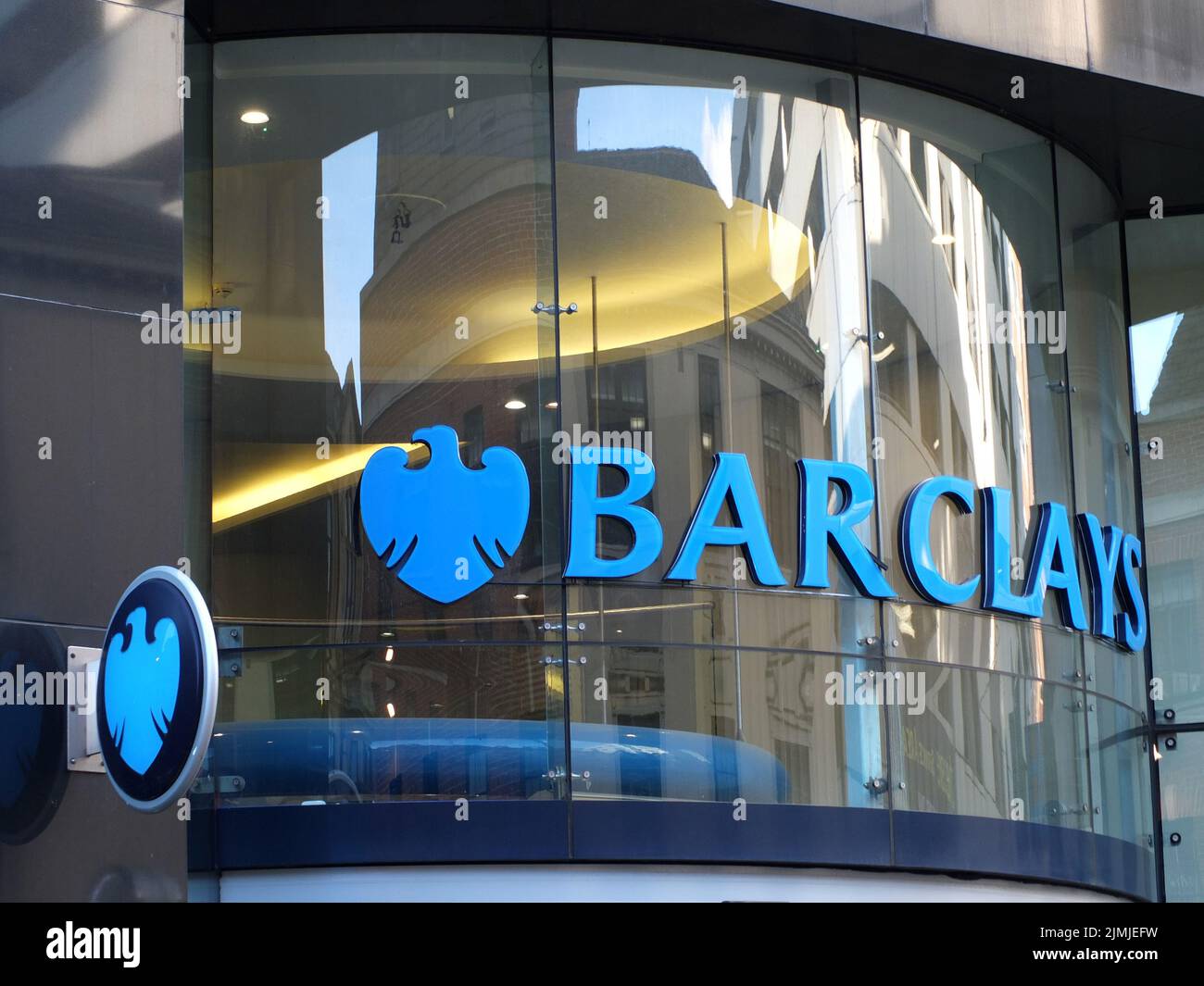 Sign and logo on the window of a branch or Barclays bank on albion ...