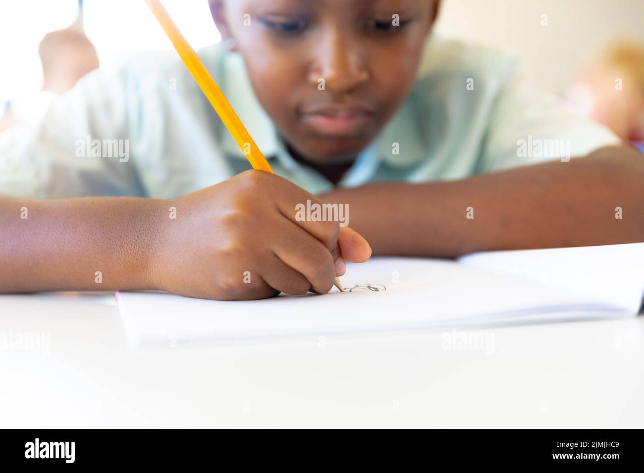 African schoolboy writing hi-res stock photography and images - Alamy