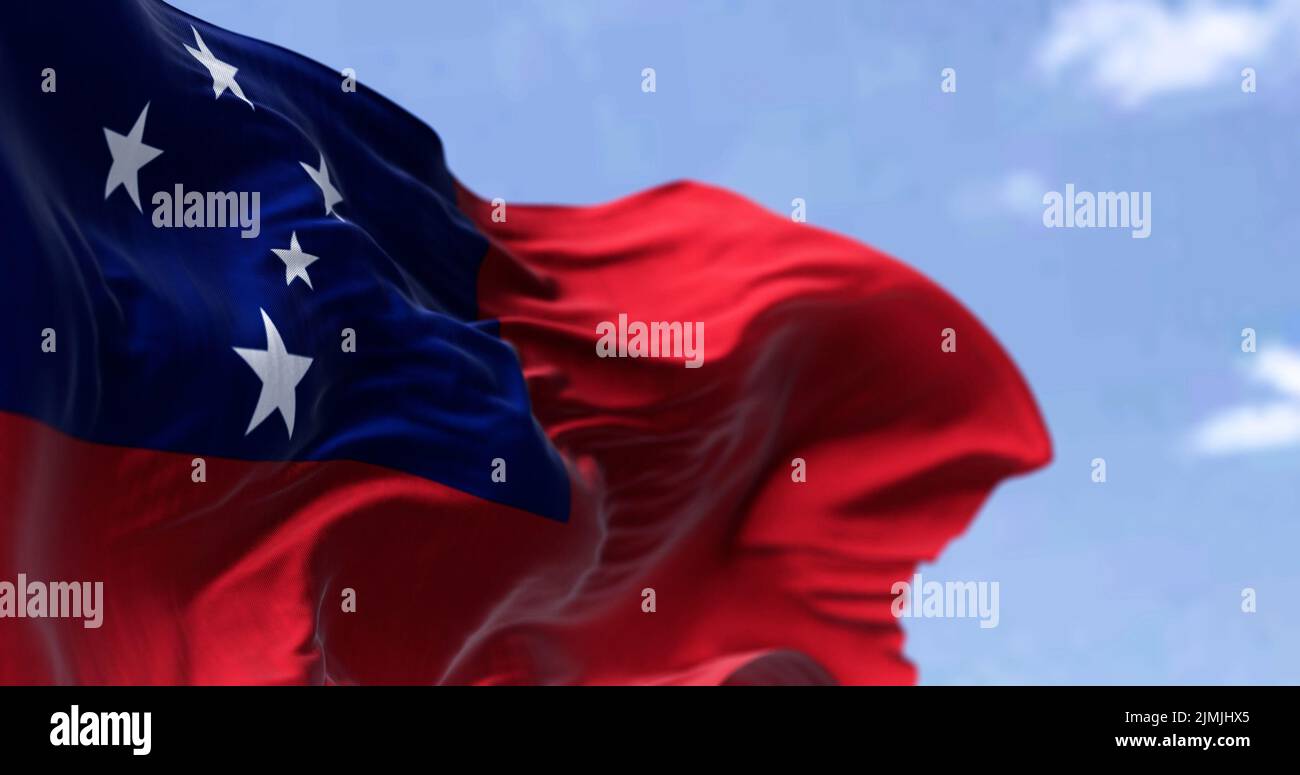 Detail of the national flag of Samoa waving in the wind on a clear day ...
