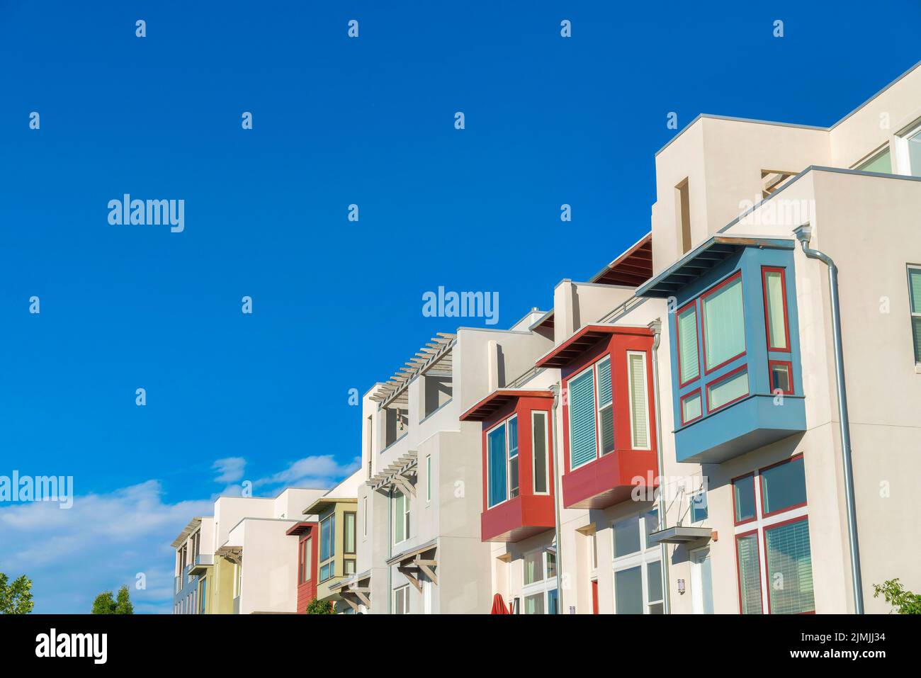 Residential complex building with colorful bay windows exterior at ...