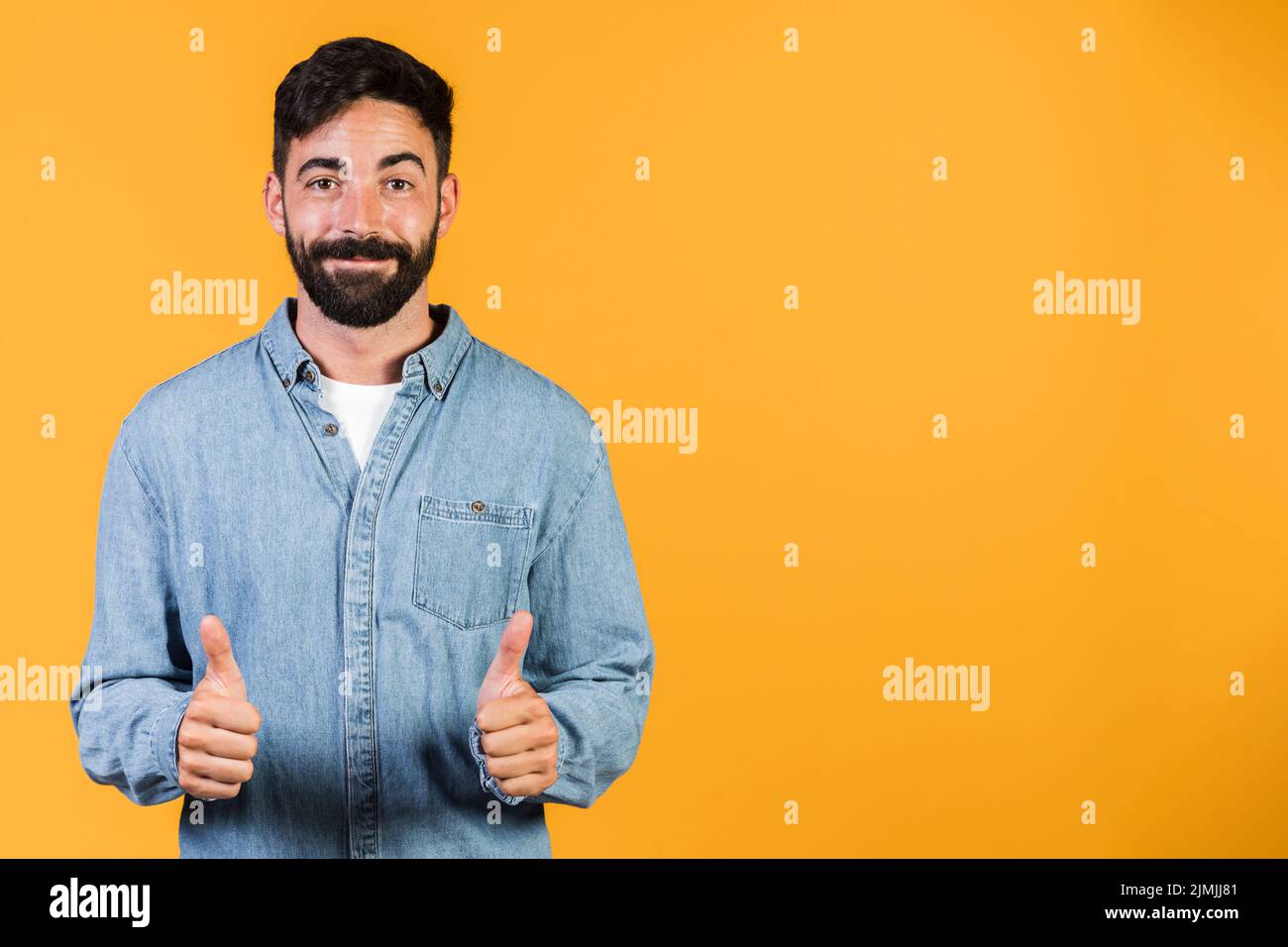Medium shot guy holding thumbs up Stock Photo - Alamy