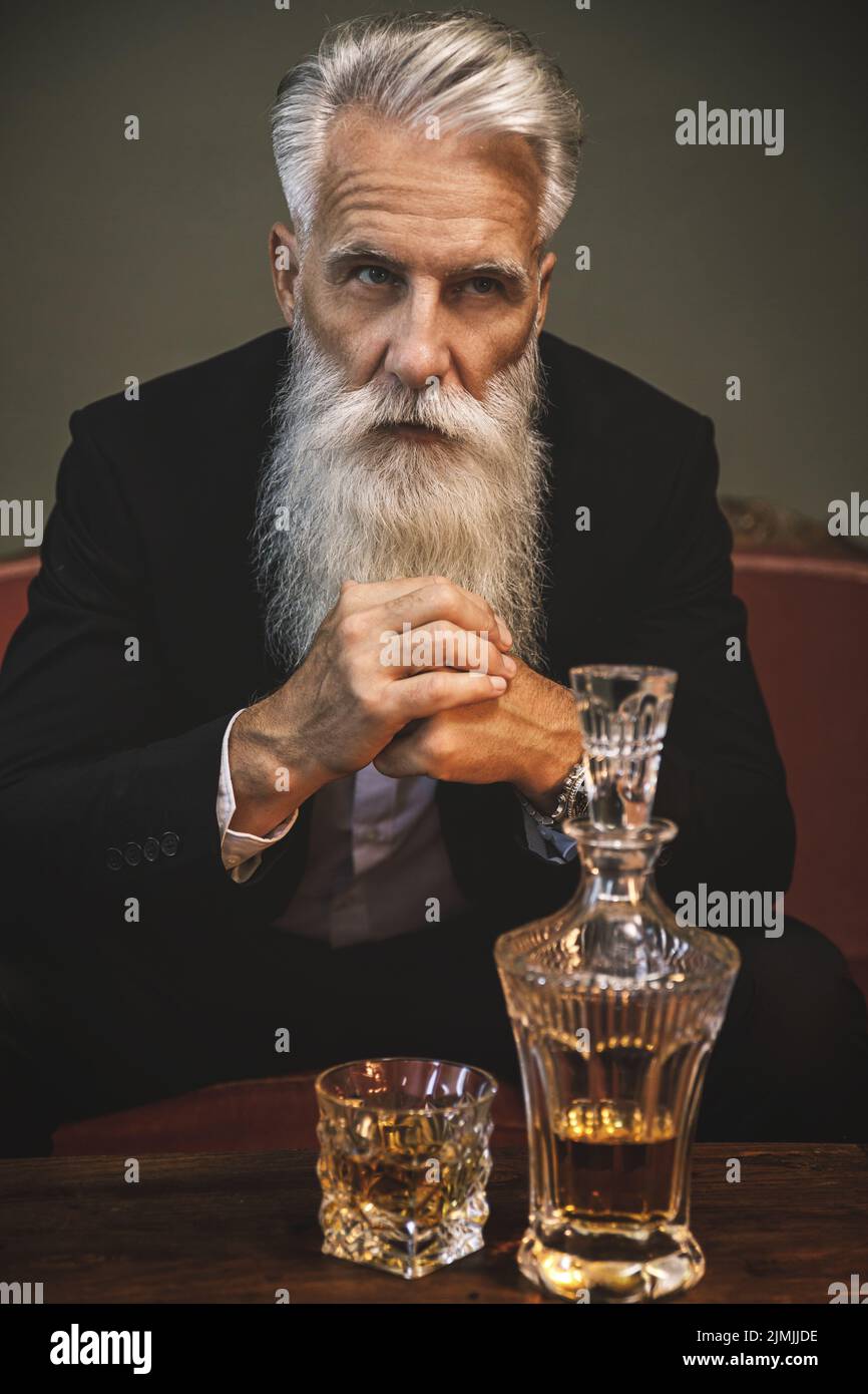 Old man drinking whisky hi-res stock photography and images - Alamy