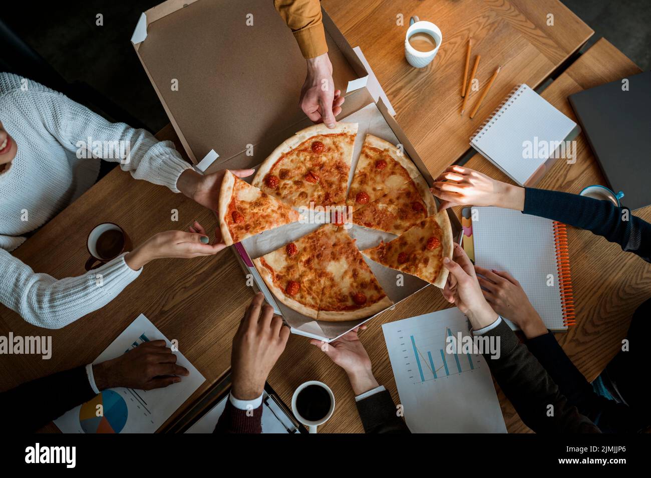 Top view colleagues having pizza during office meeting break Stock ...