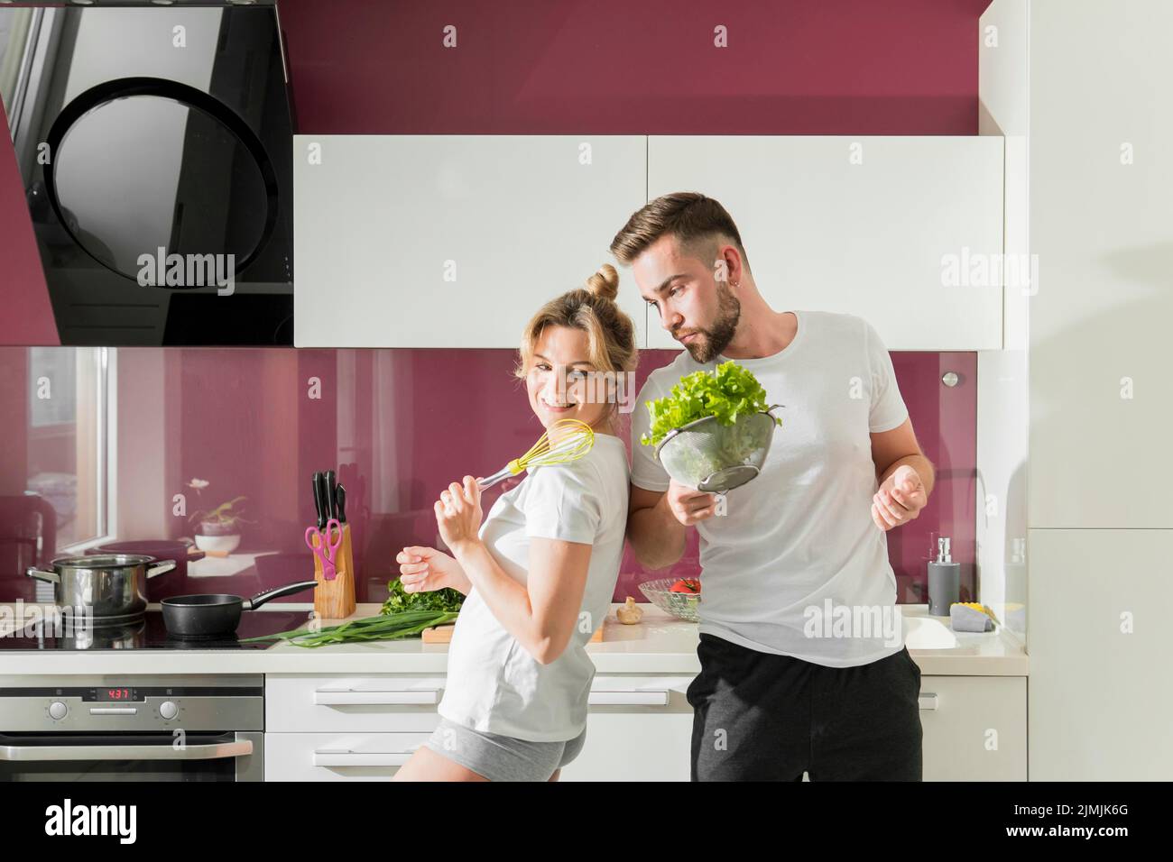 Beautiful couple hugging in kitchen hi-res stock photography and images ...