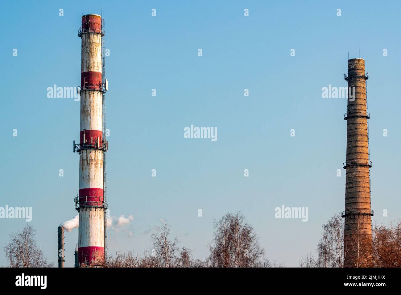 Factory chimneys on a sky background Stock Photo - Alamy