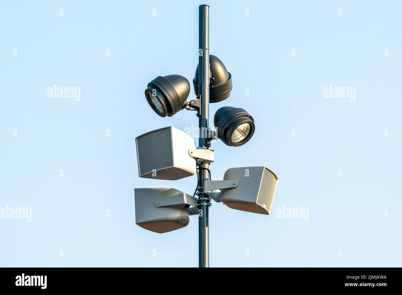 Speakers and lights suspended from a metal pole Stock Photo - Alamy