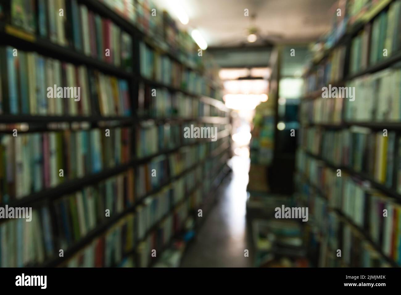 Blurred background of books in the library Stock Photo - Alamy
