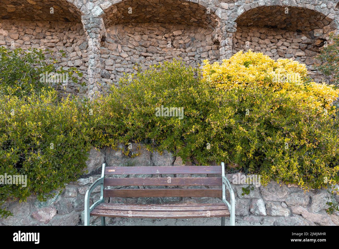 Stone columns and bench in Park Guell in Barcelona, Spain Stock Photo ...