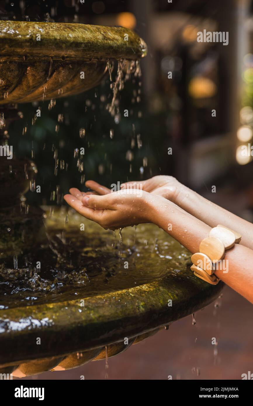 Female hands ancient fountain with splashing water drops Stock Photo ...