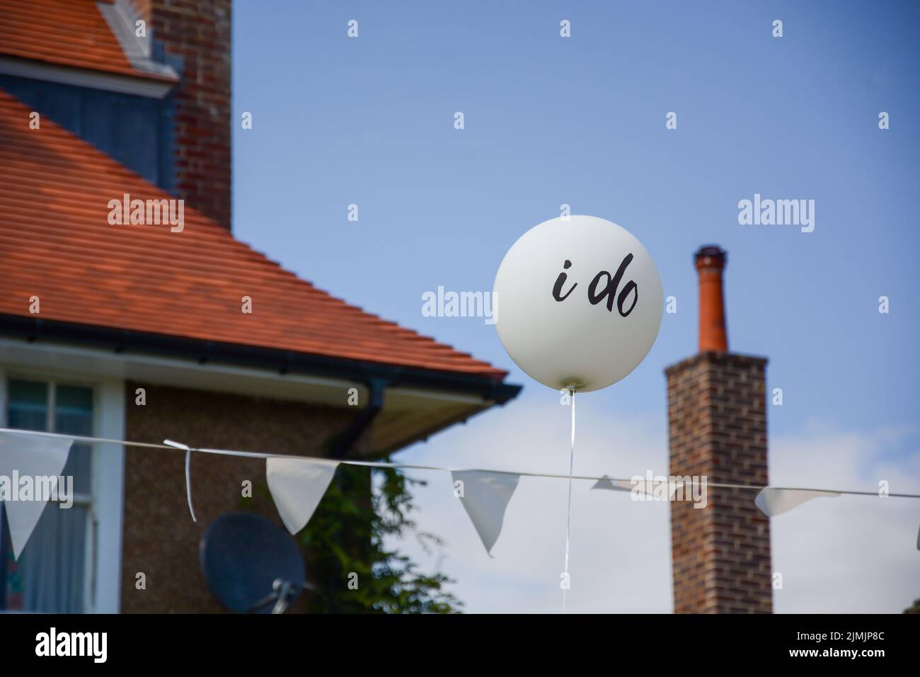 A white balloon with "I do" text printed on it Stock Photo - Alamy