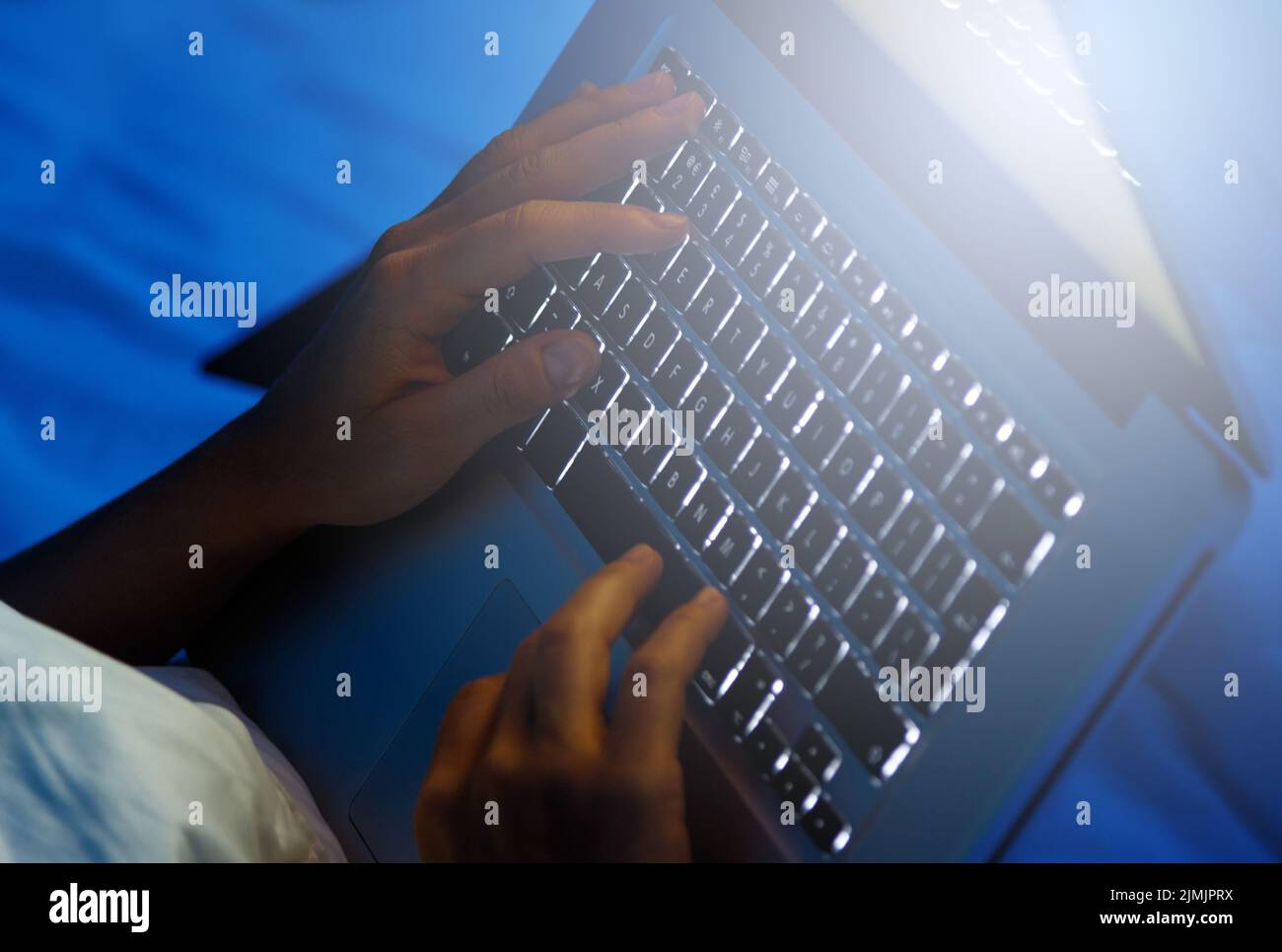 Female hands on the laptop computer keyboard at the night time Stock ...