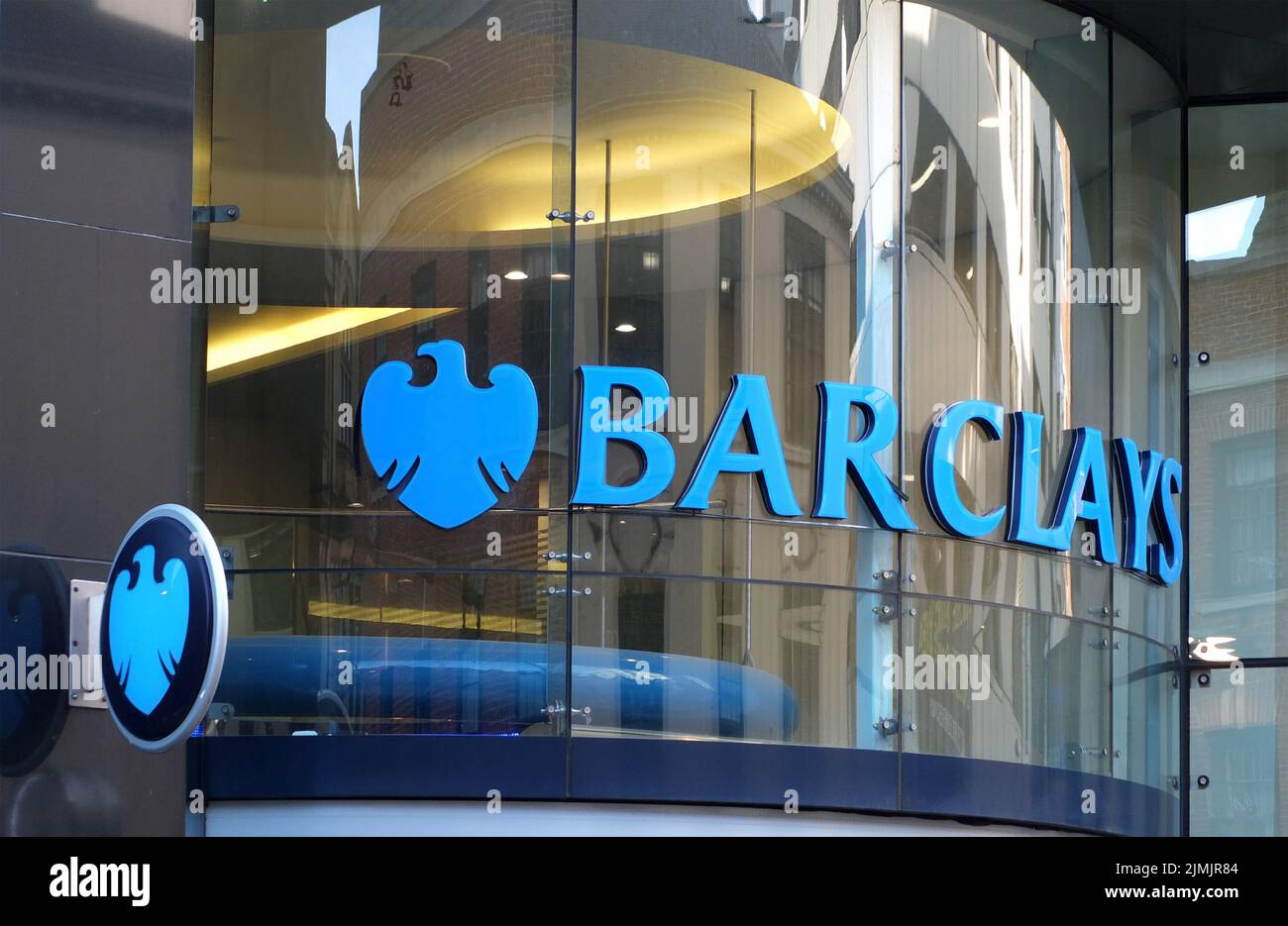 Sign and logo on the window of a branch or Barclays bank on albion ...