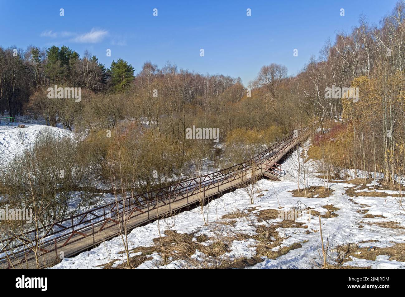 Pedestrian bridge at the bottom of a small ravine Stock Photo - Alamy