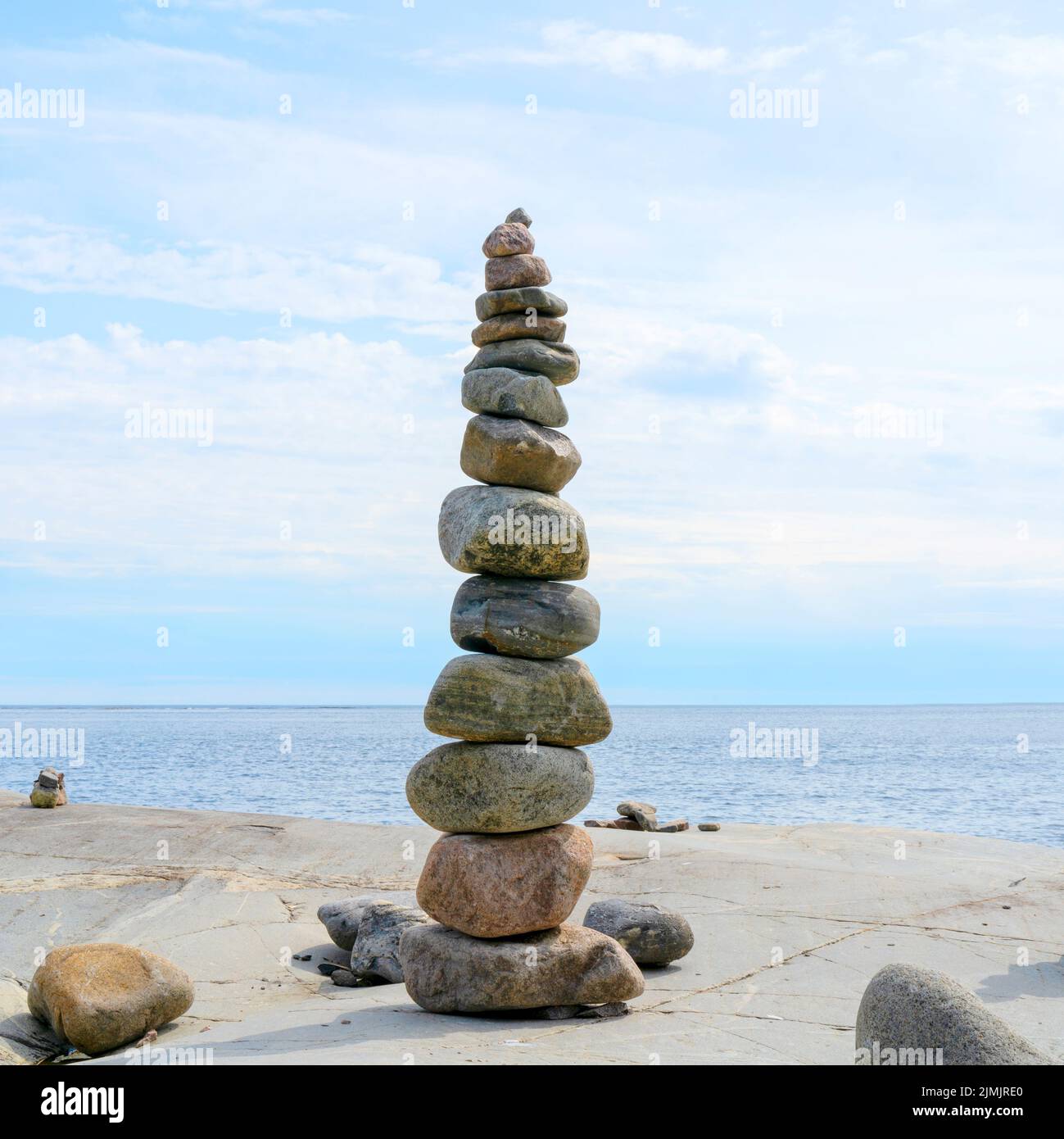 Stacked Rocks balancing, stacking with precision. Stone tower on the ...