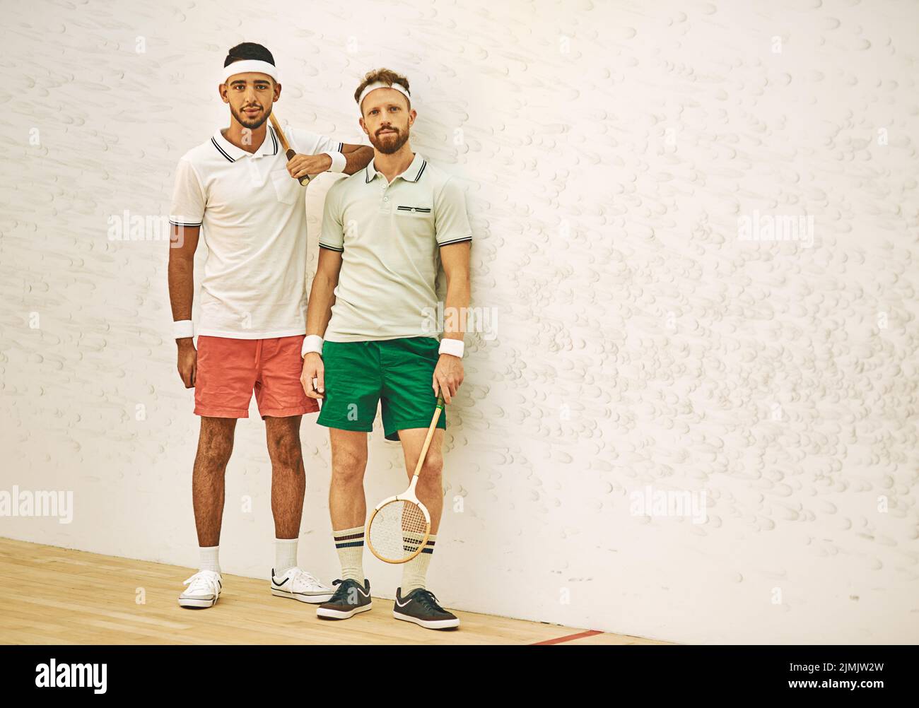 Theres nobody like a squash buddy. two confident young men standing ...