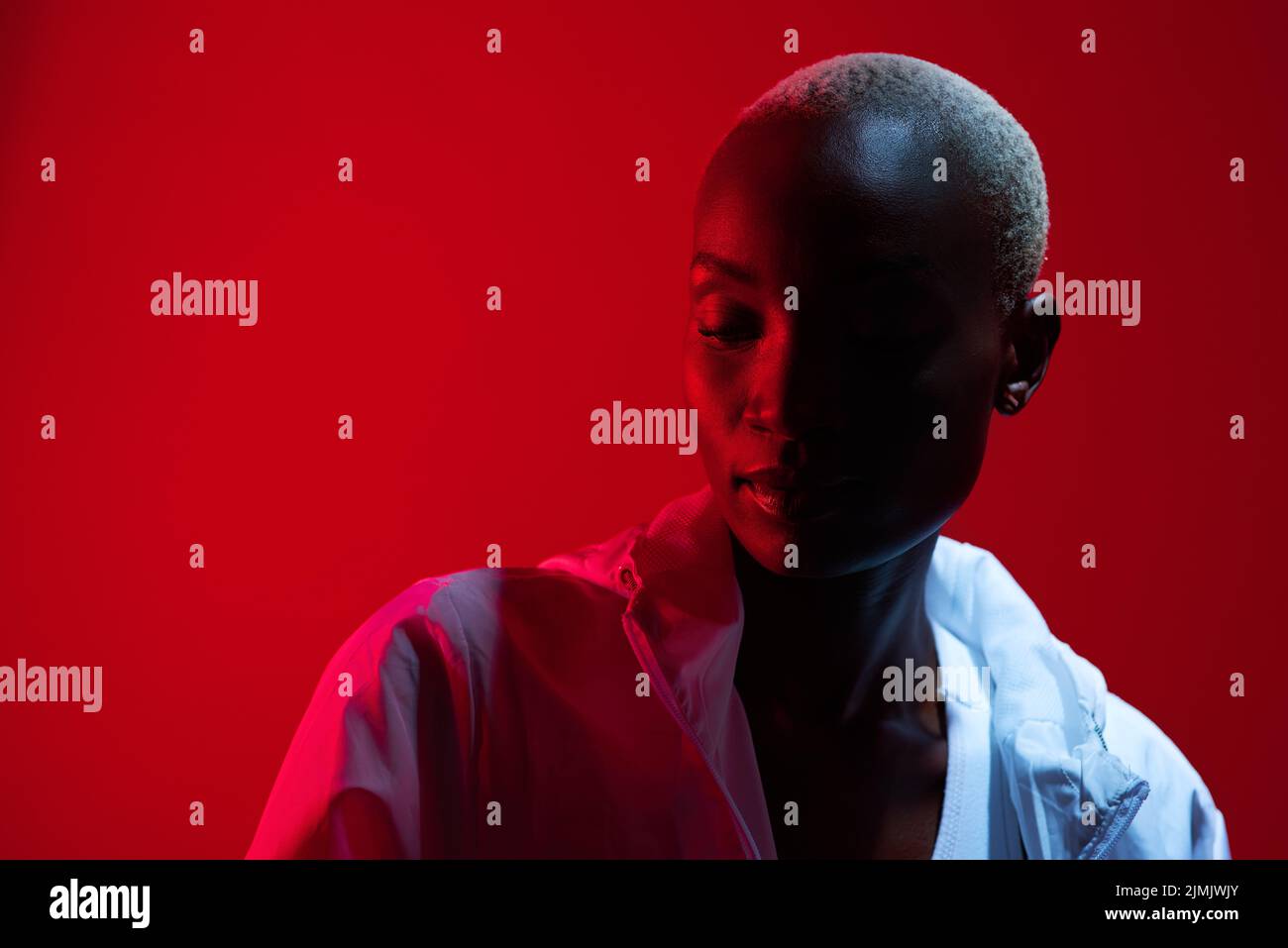 You are all you have. Red filtered shot of a beautiful young woman ...