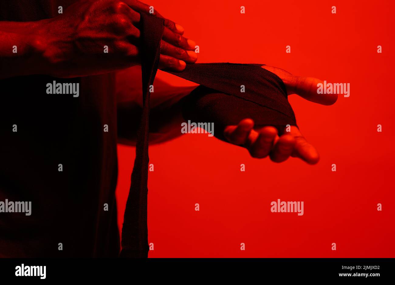Guy wrapping hands before boxing hi-res stock photography and images ...