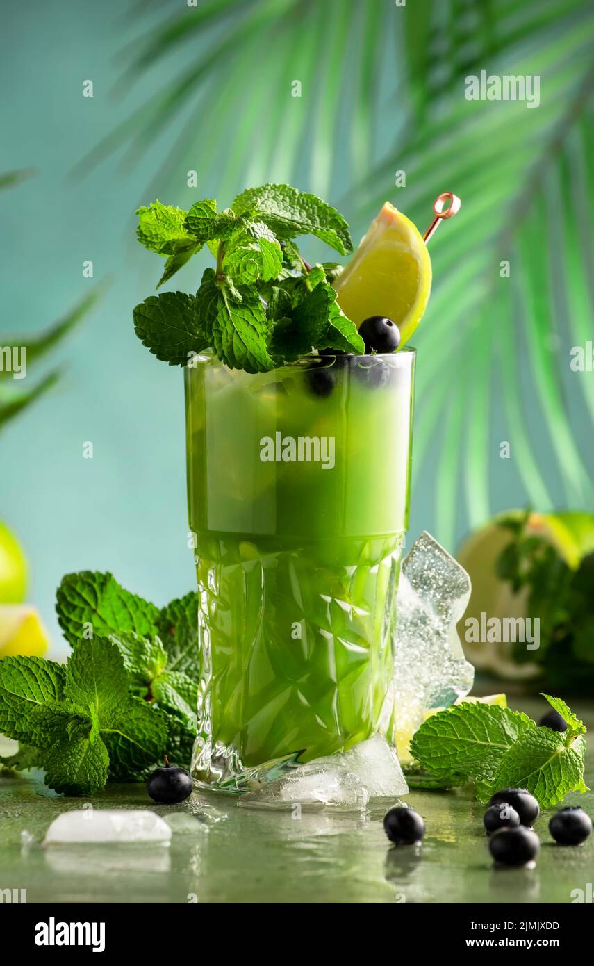 Green alcoholic cocktail with gin, tequila, liquor, juice, lime ...