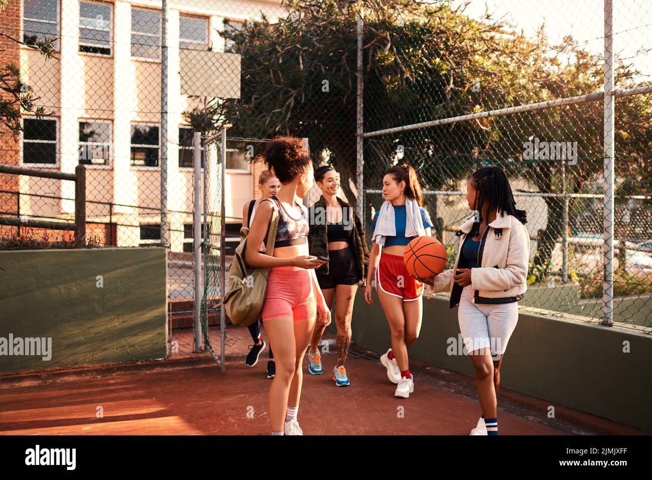 This is how we bond. a diverse group of friends getting ready to play a ...