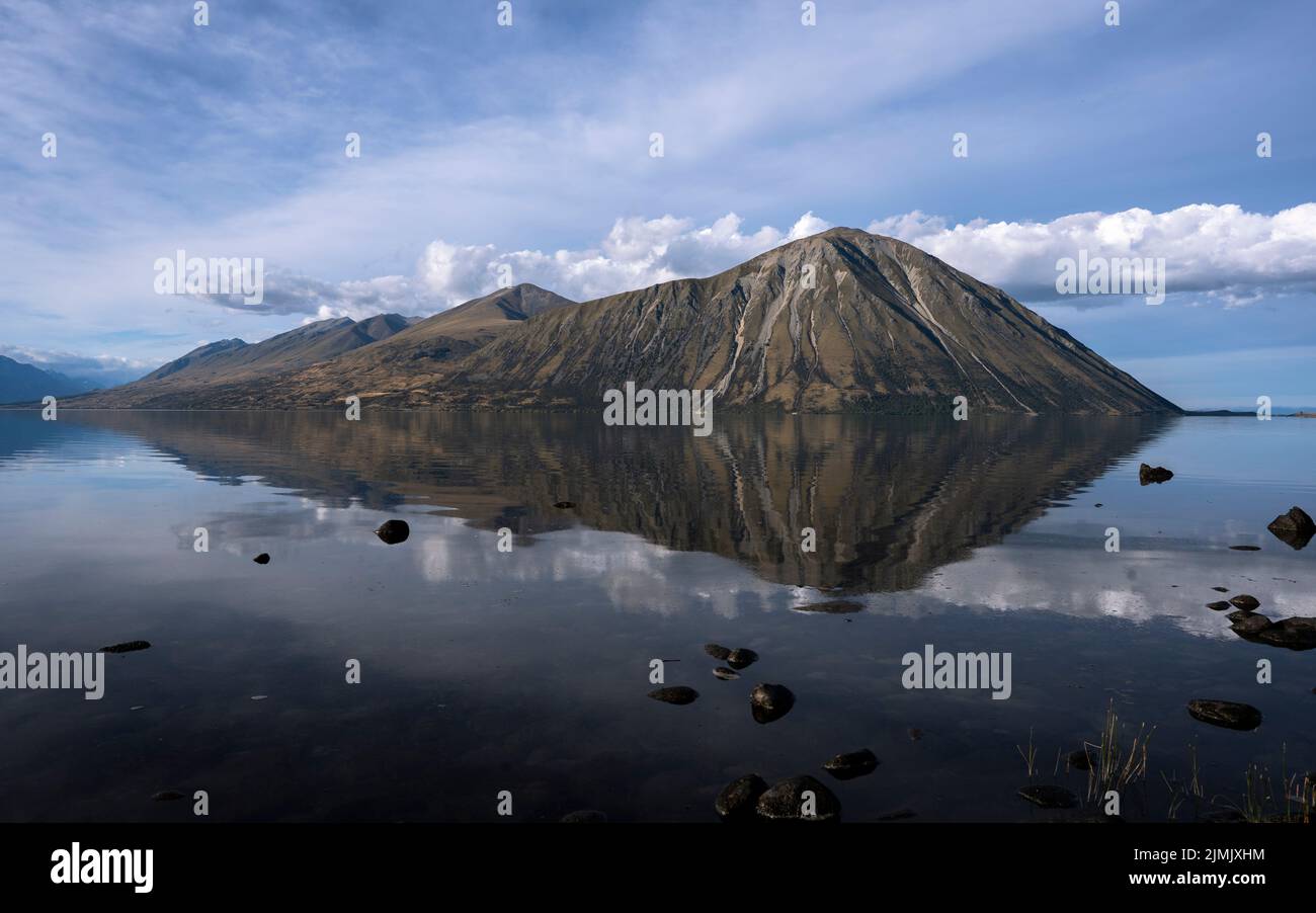 Mountain and lake landscape in New Zealand with a reflection and sunny ...