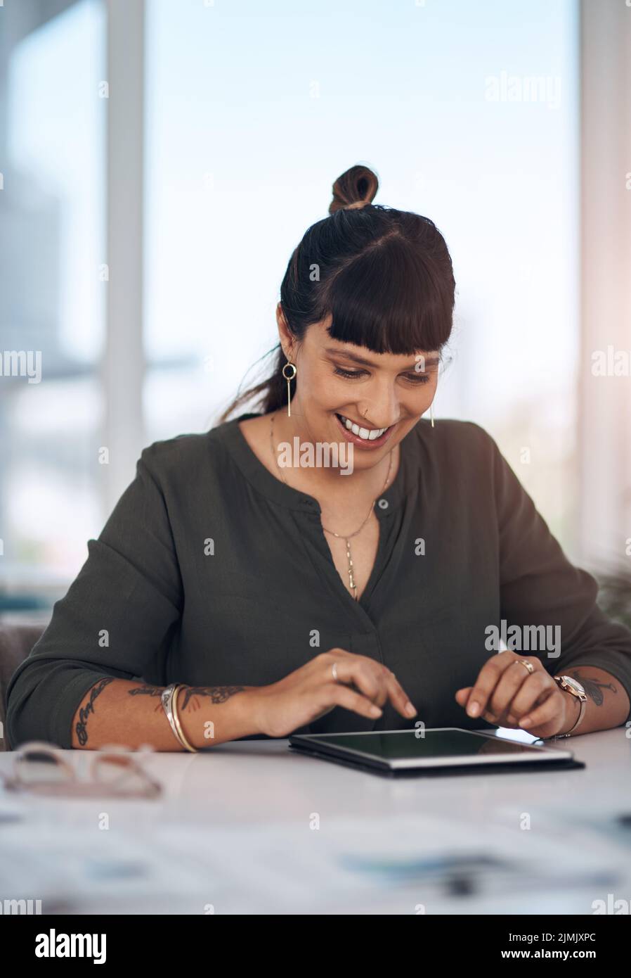 Technology connects the world. an attractive young businesswoman ...
