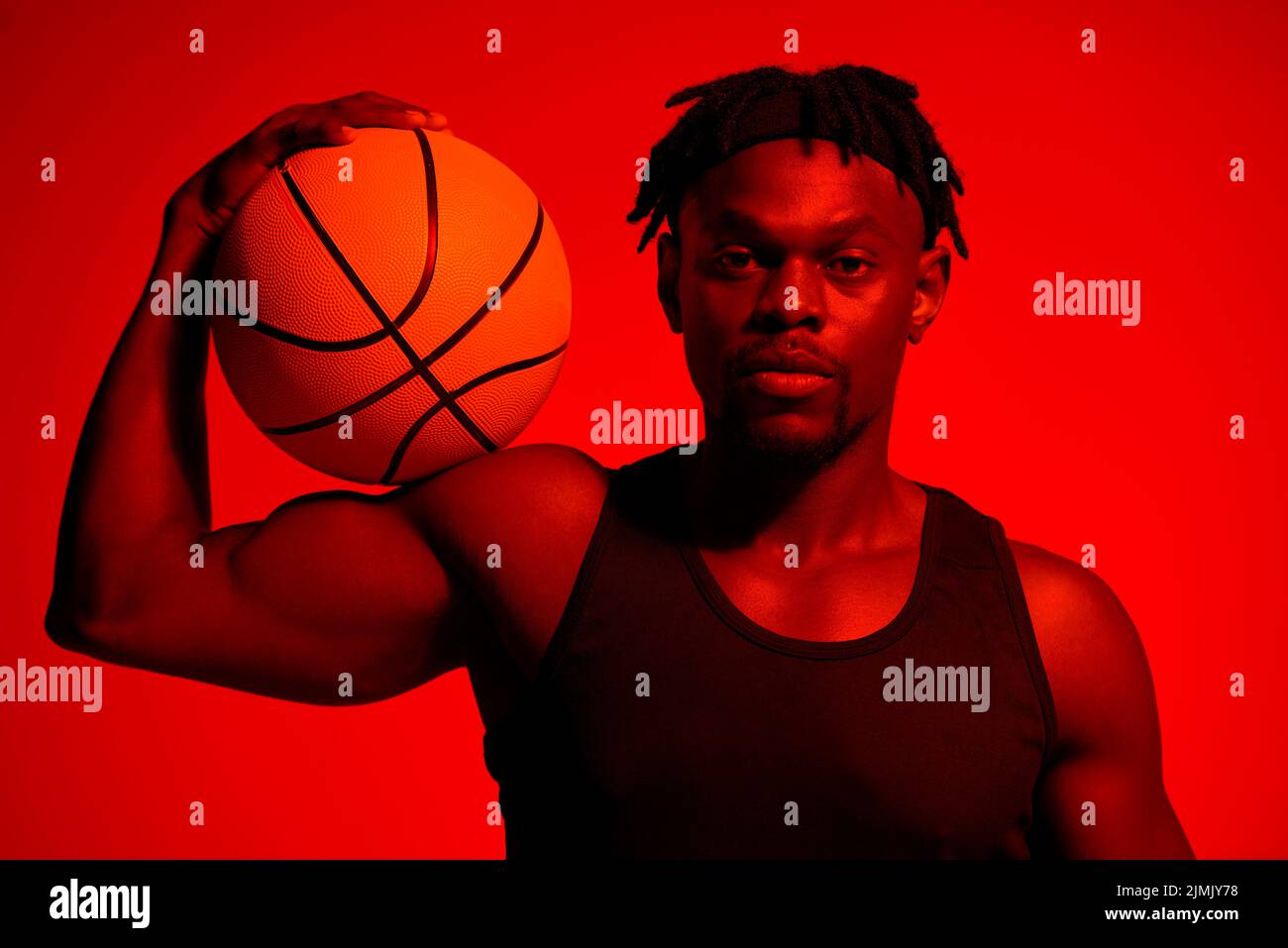 Get your game face on. Red filtered shot of a young sportsman posing ... Get your game face on. Red filtered shot of a young sportsman posing ...