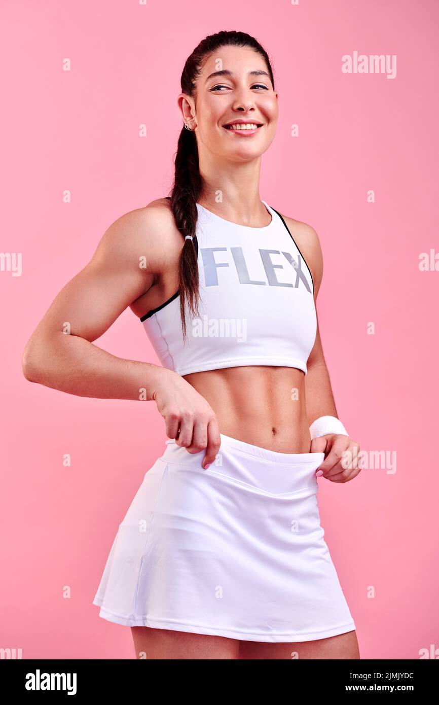 Staying in tiptop shape. Studio shot of a sporty young woman posing ...