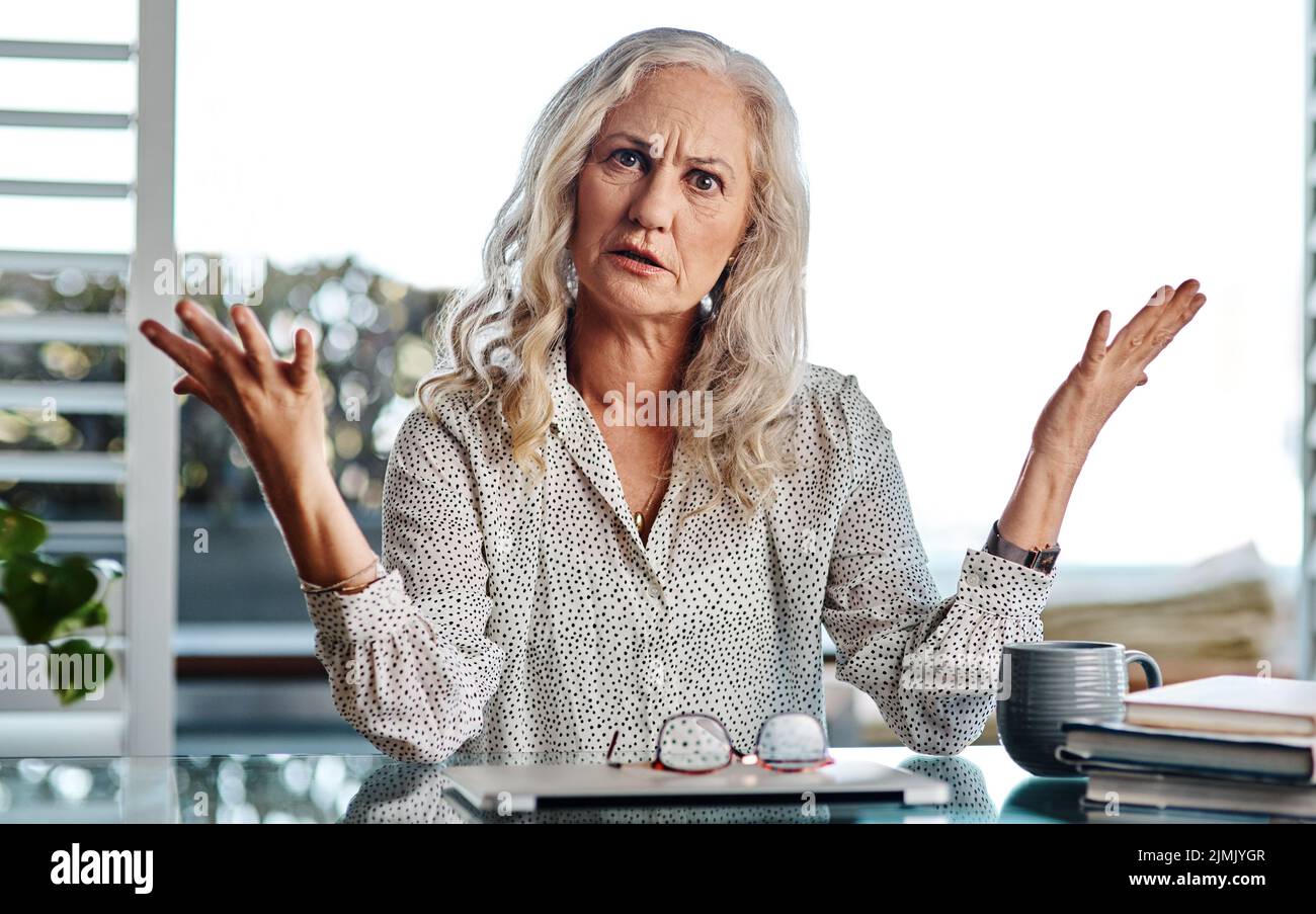 Whats happening. Cropped portrait of an attractive senior businesswoman ...