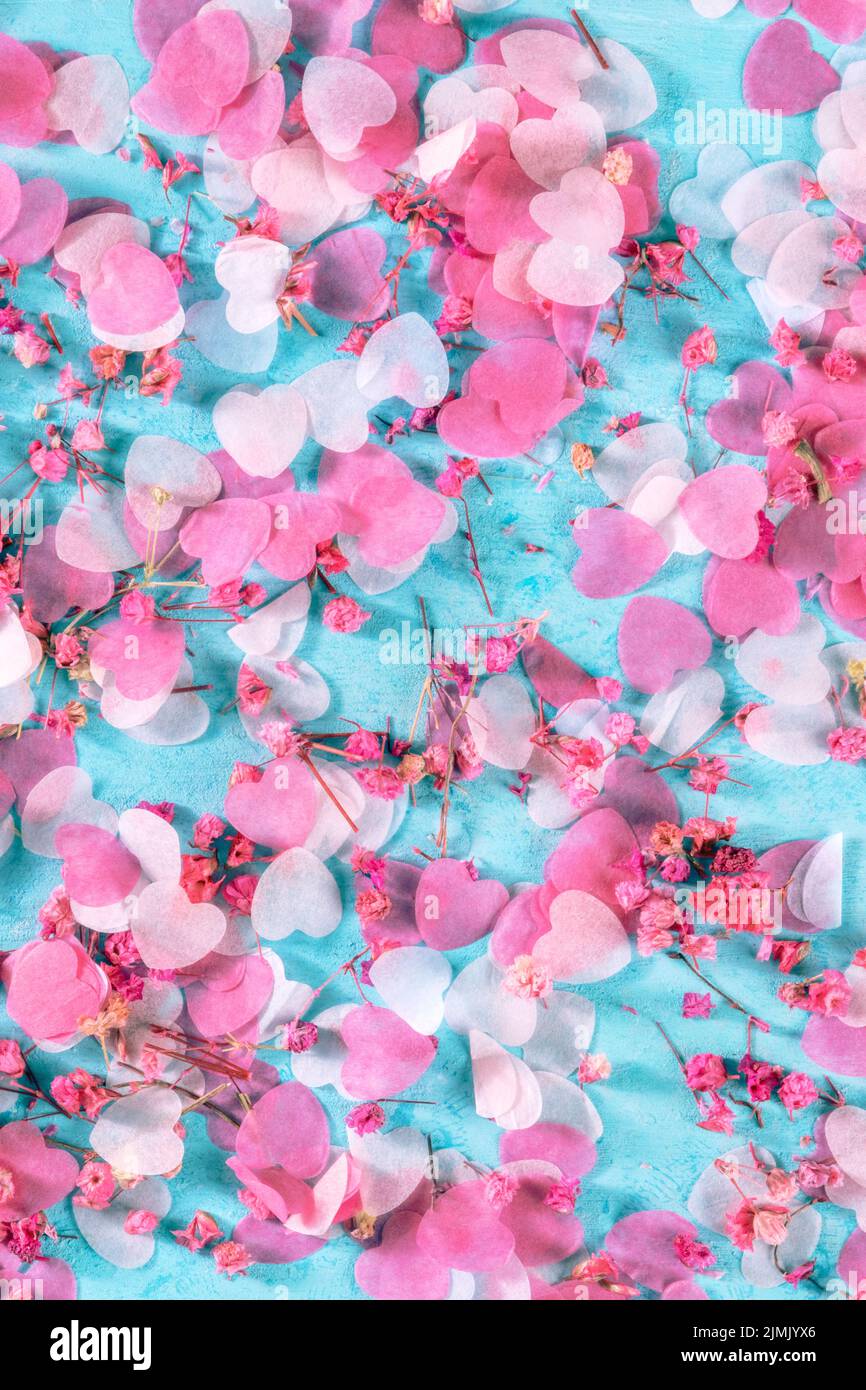 Valentine day background with pink hearts and rose flowers confetti ...